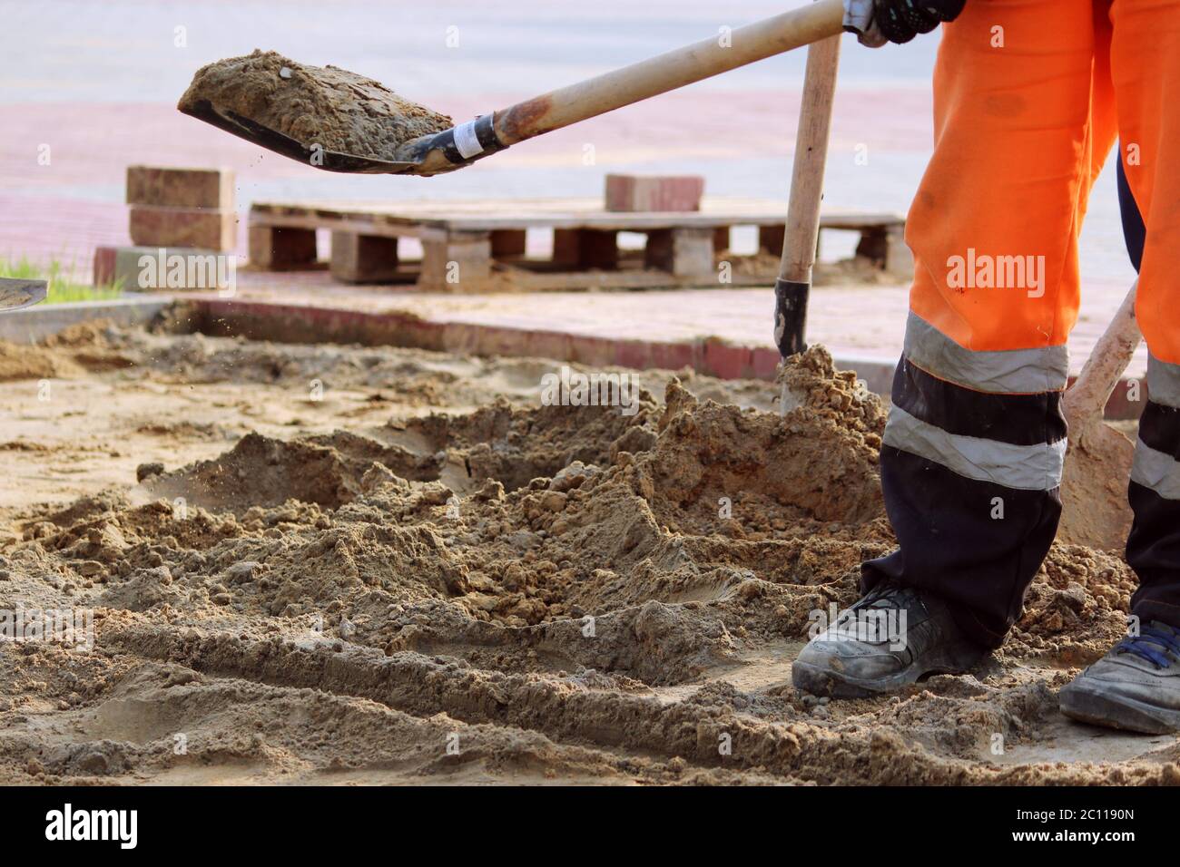 masons sand throw shovels for laying paving slabs in the town square ...