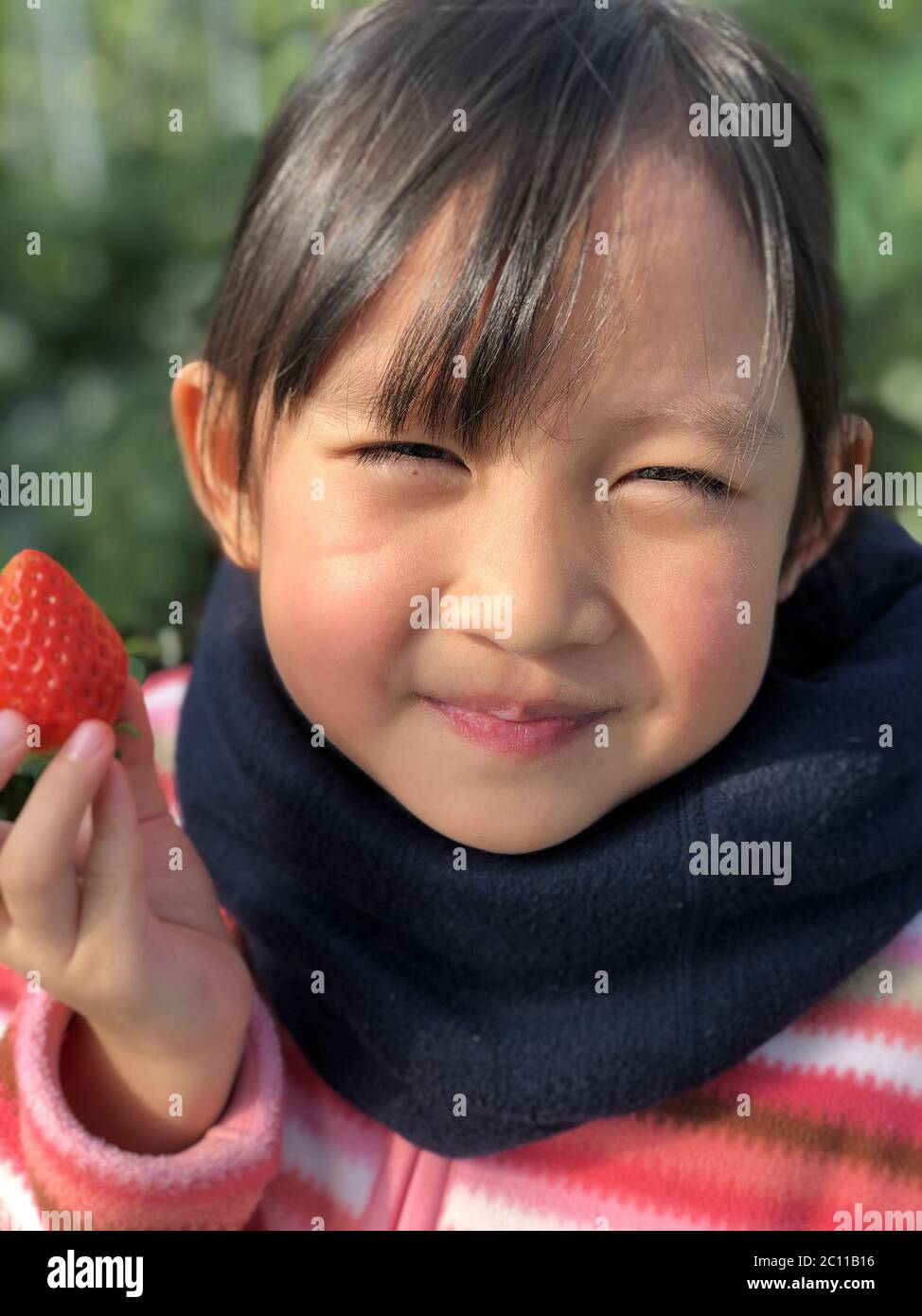 Japan, Chiba, Smiling cute Asian kid, child, young girl tourist ...