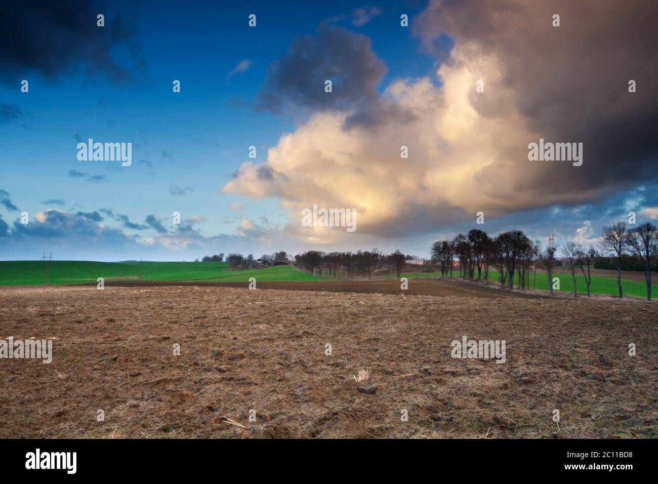 Dramatic sunset sky with clouds over rural field in Poland Stock Photo ...