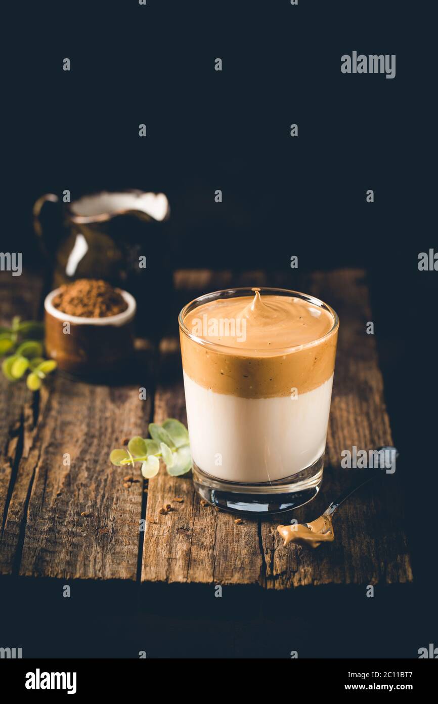 Dalgona Coffee, a cool fluffy whipped coffee in a glass. Latte espresso ...