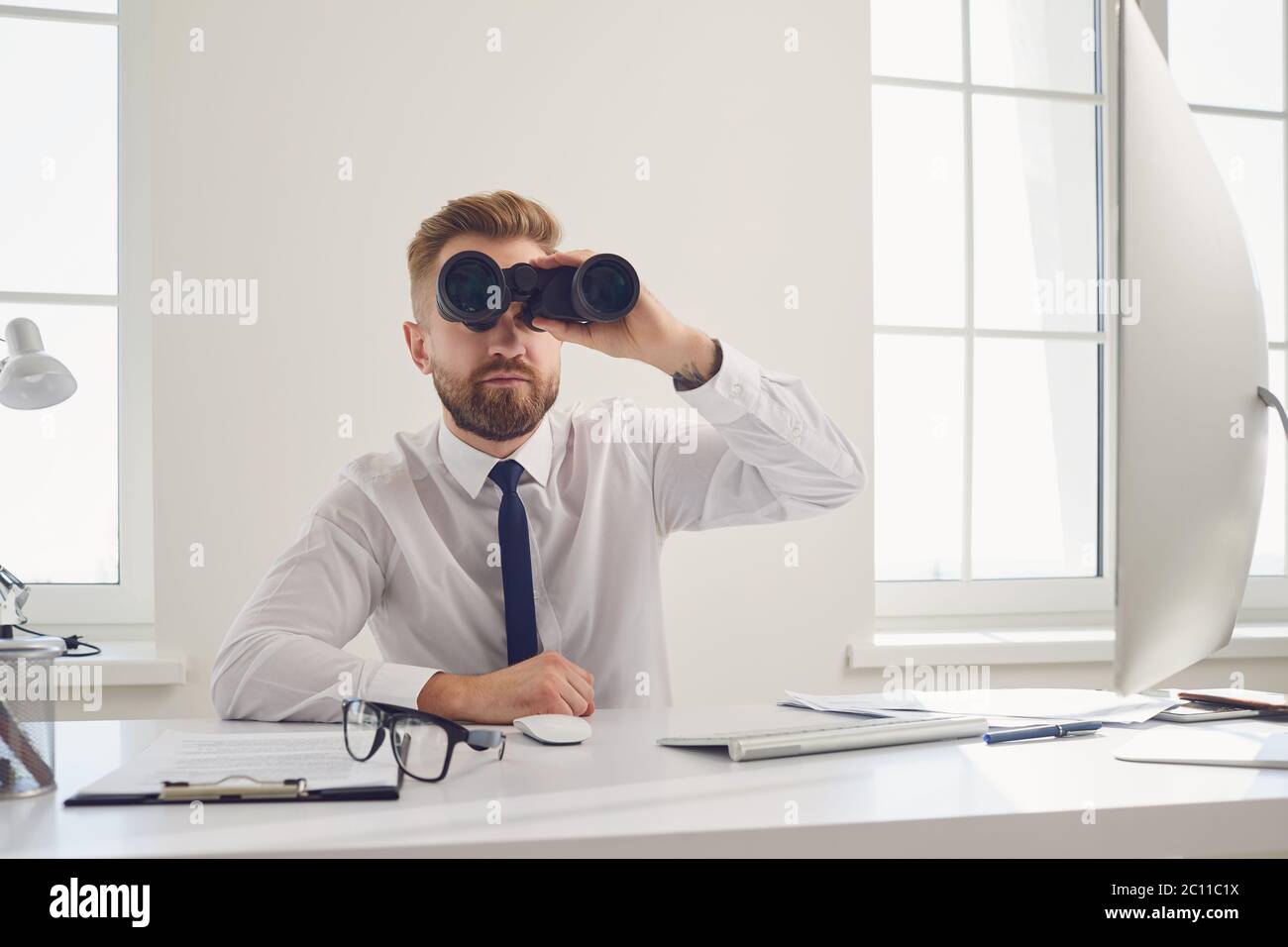 Sitting man binocular hi-res stock photography and images - Alamy