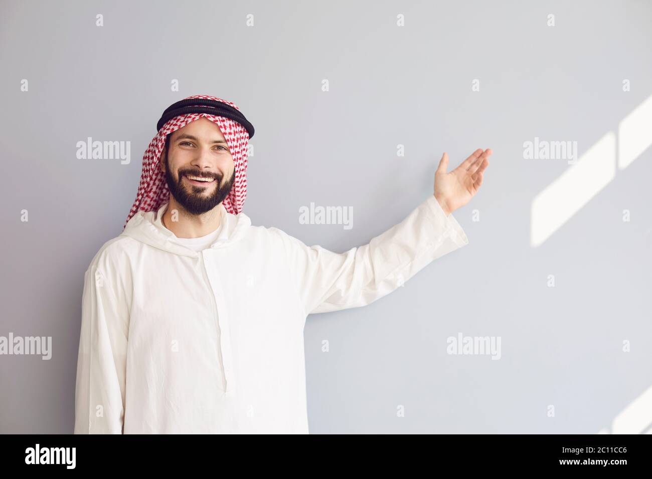 Young smiling arab showing hi-res stock photography and images - Alamy