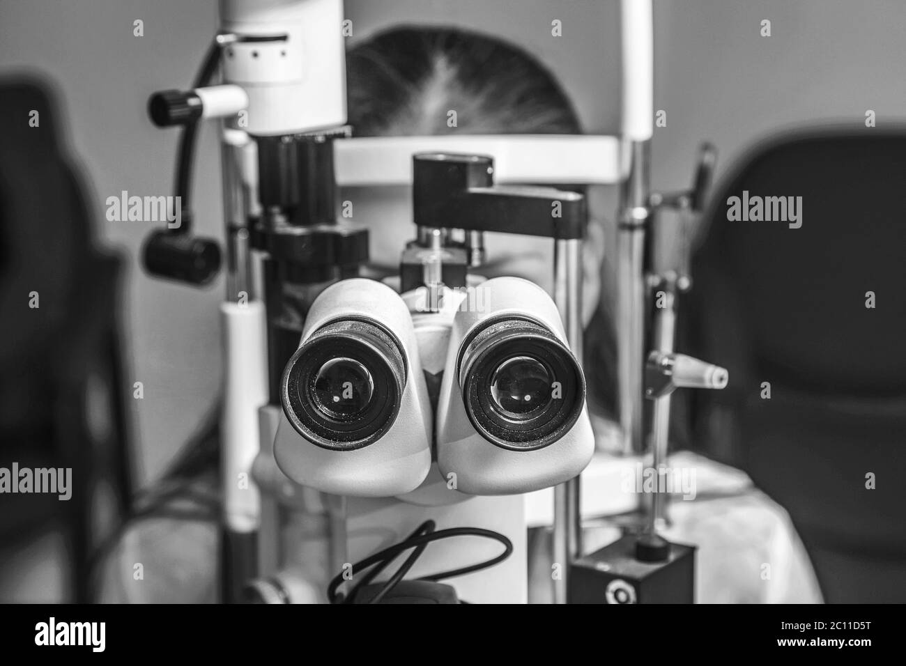 Beautiful young woman having eye test at the optometrist Stock Photo ...
