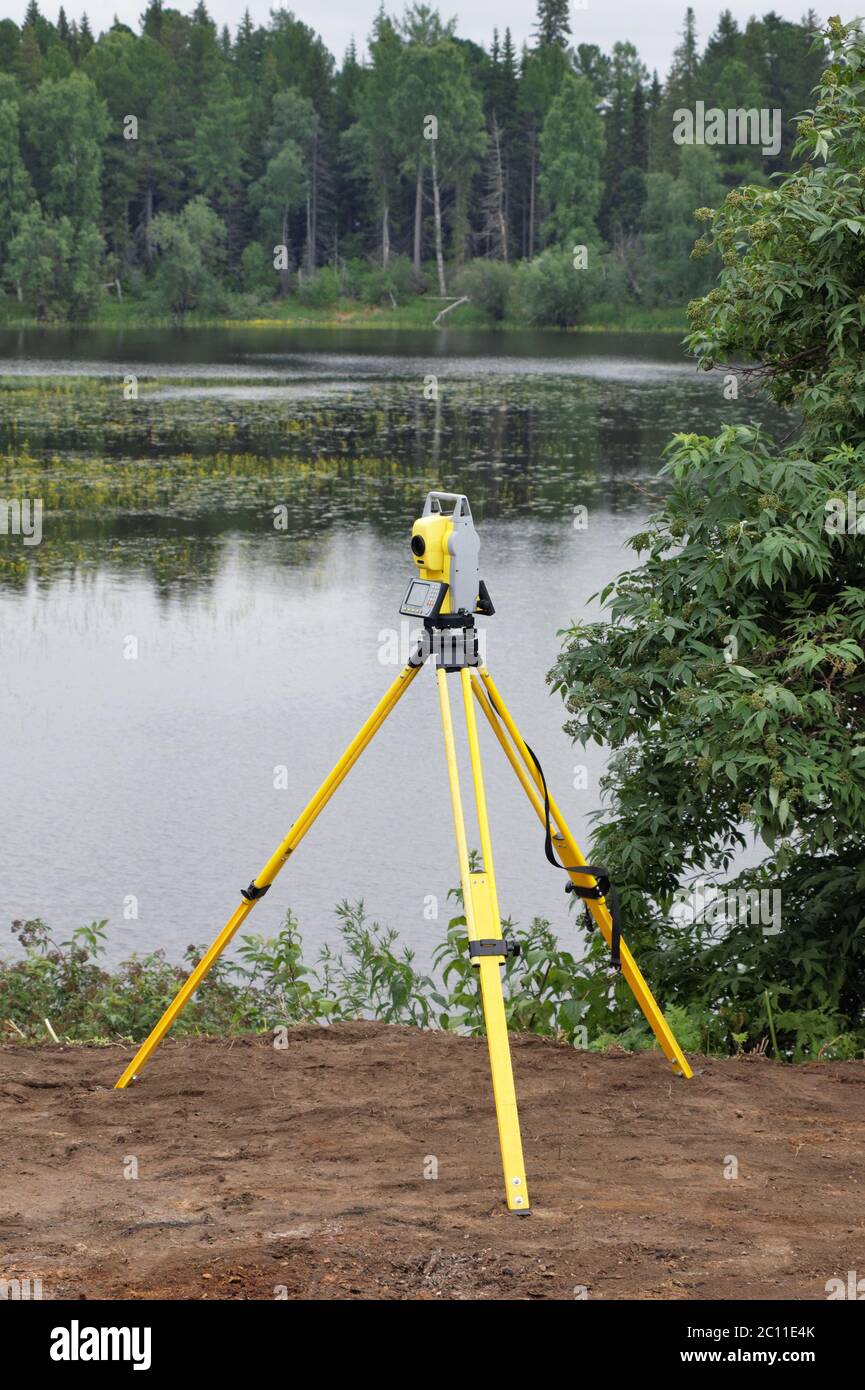 The total station is installed on a tripod, use in the field to ...