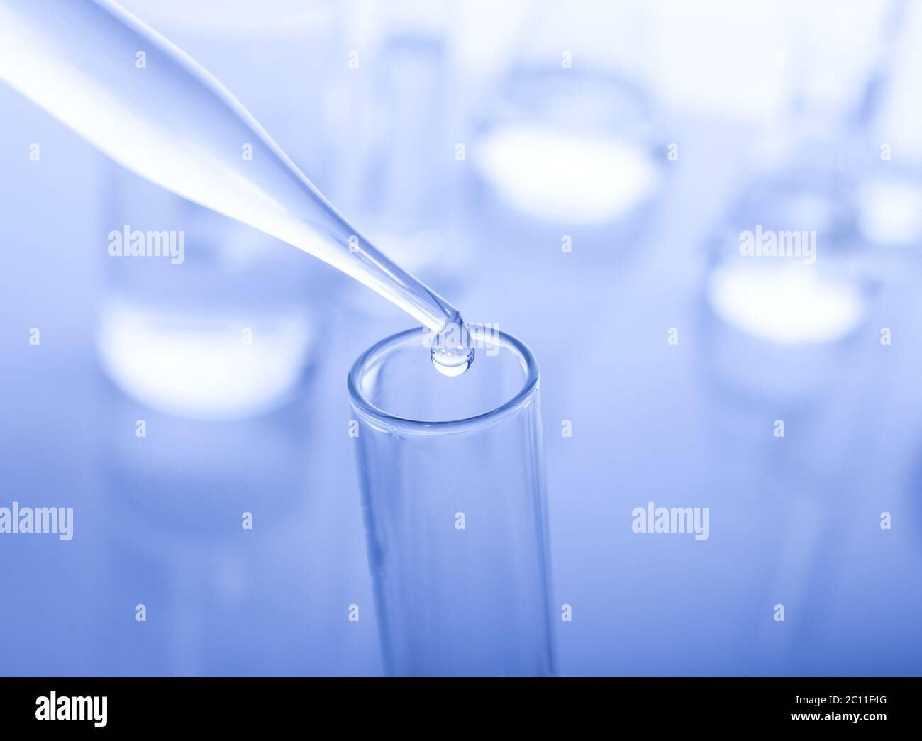 Test-tubes on a white and blue background Stock Photo - Alamy