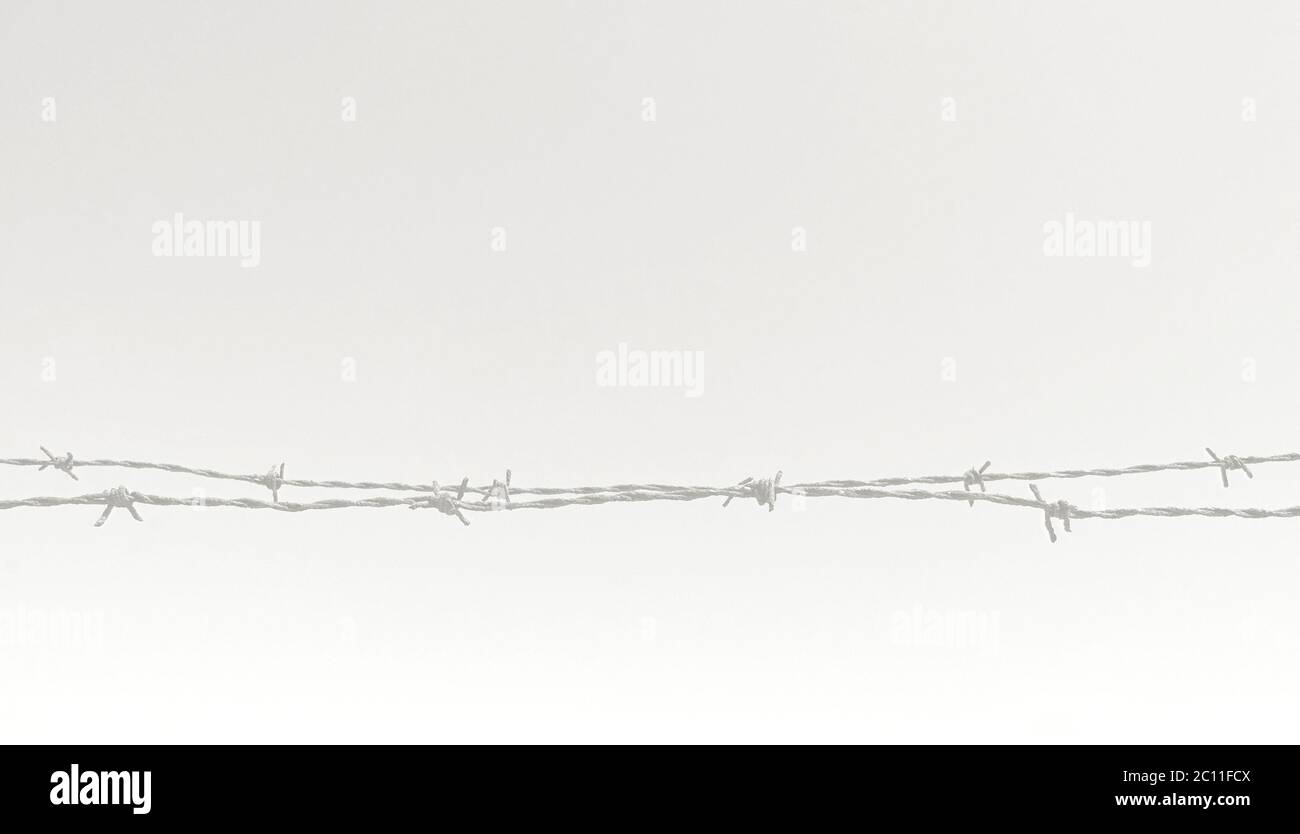 Rusty barbed wire fence closeup Stock Photo - Alamy