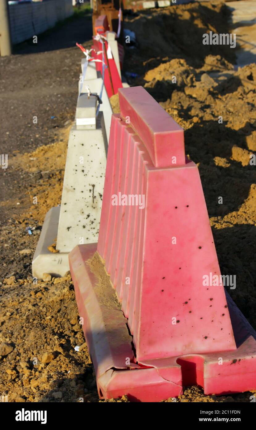 Red and white plastic barriers blocking the road Stock Photo - Alamy