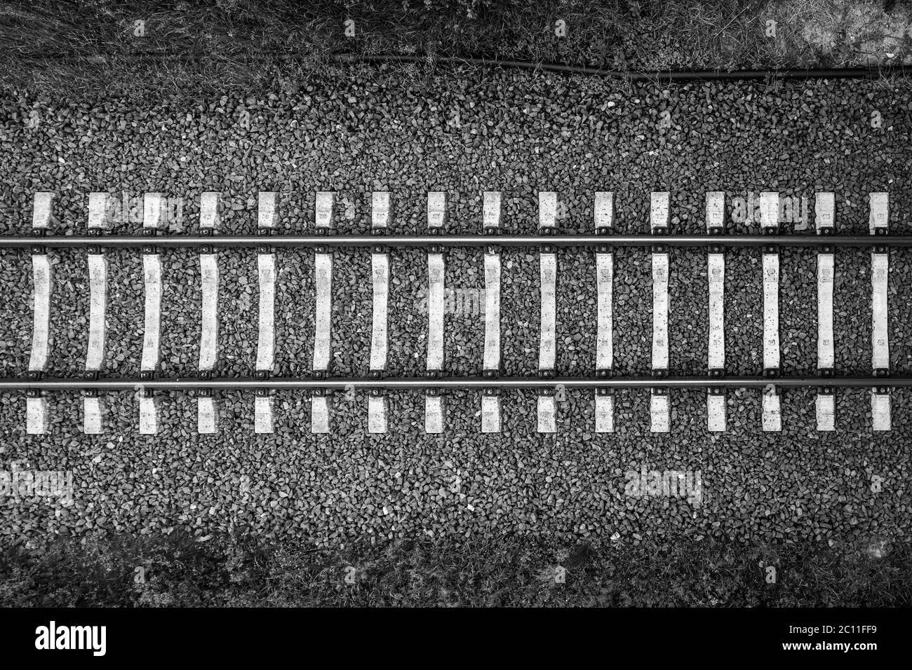 Railway tracks on a railway track bed lead through the picture Stock ...