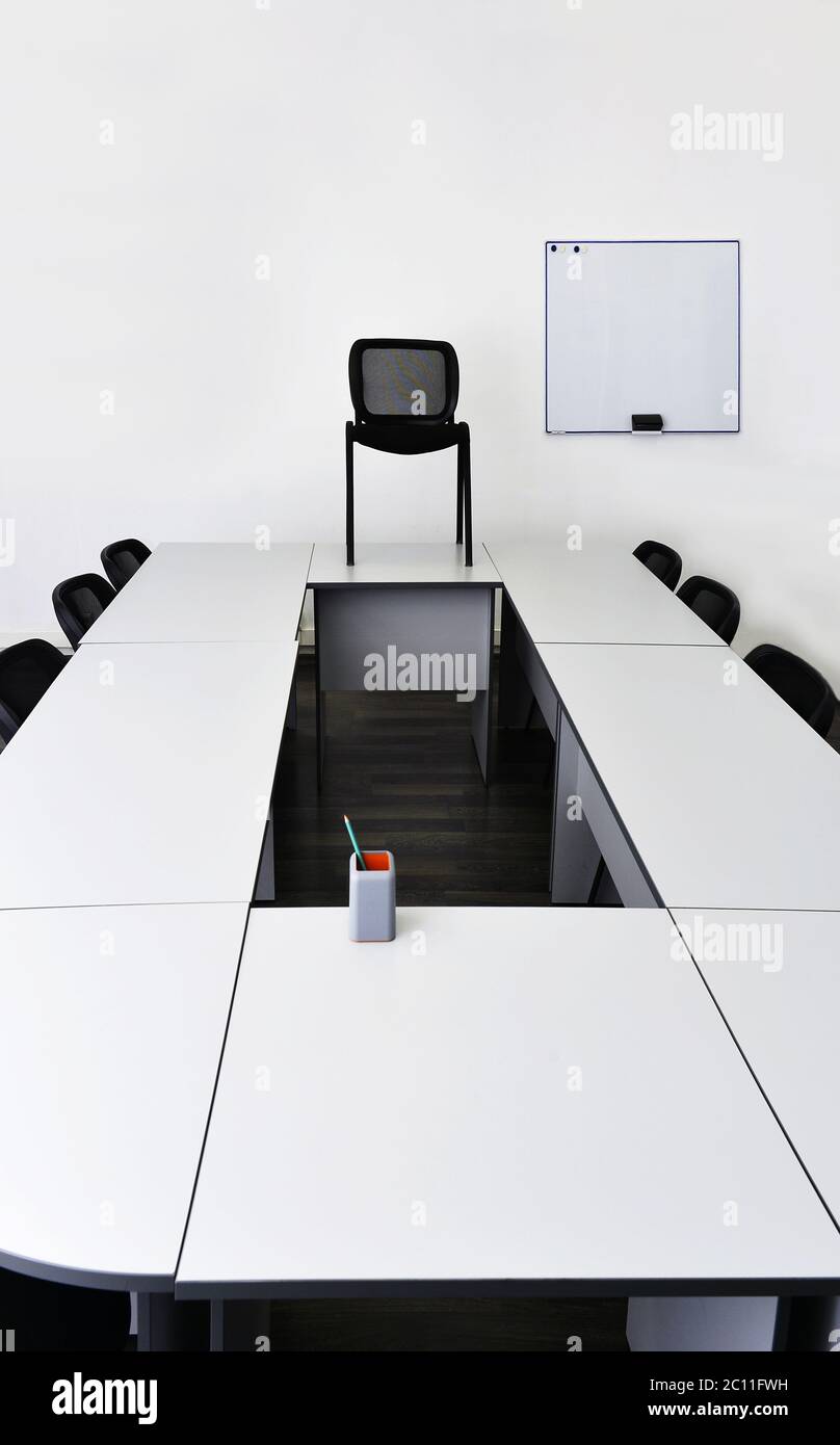 Empty meeting room in the office with tables and chairs Stock Photo - Alamy