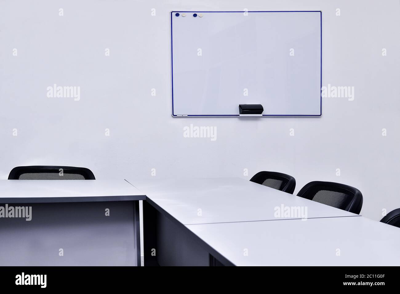 Empty meeting room in the office with tables and chairs Stock Photo - Alamy