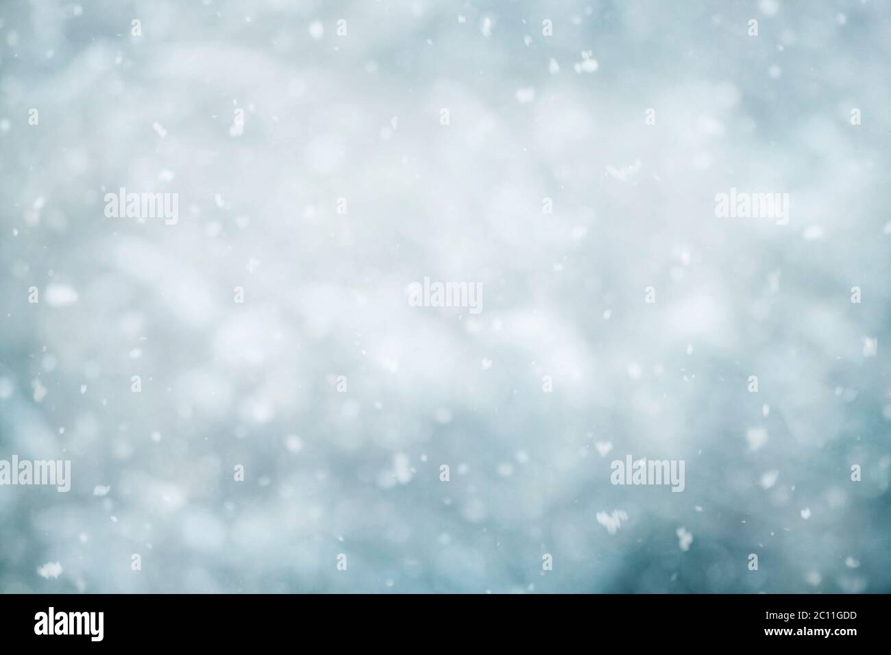 Snow falling and floating on the air, wintry xmas abstract background ...