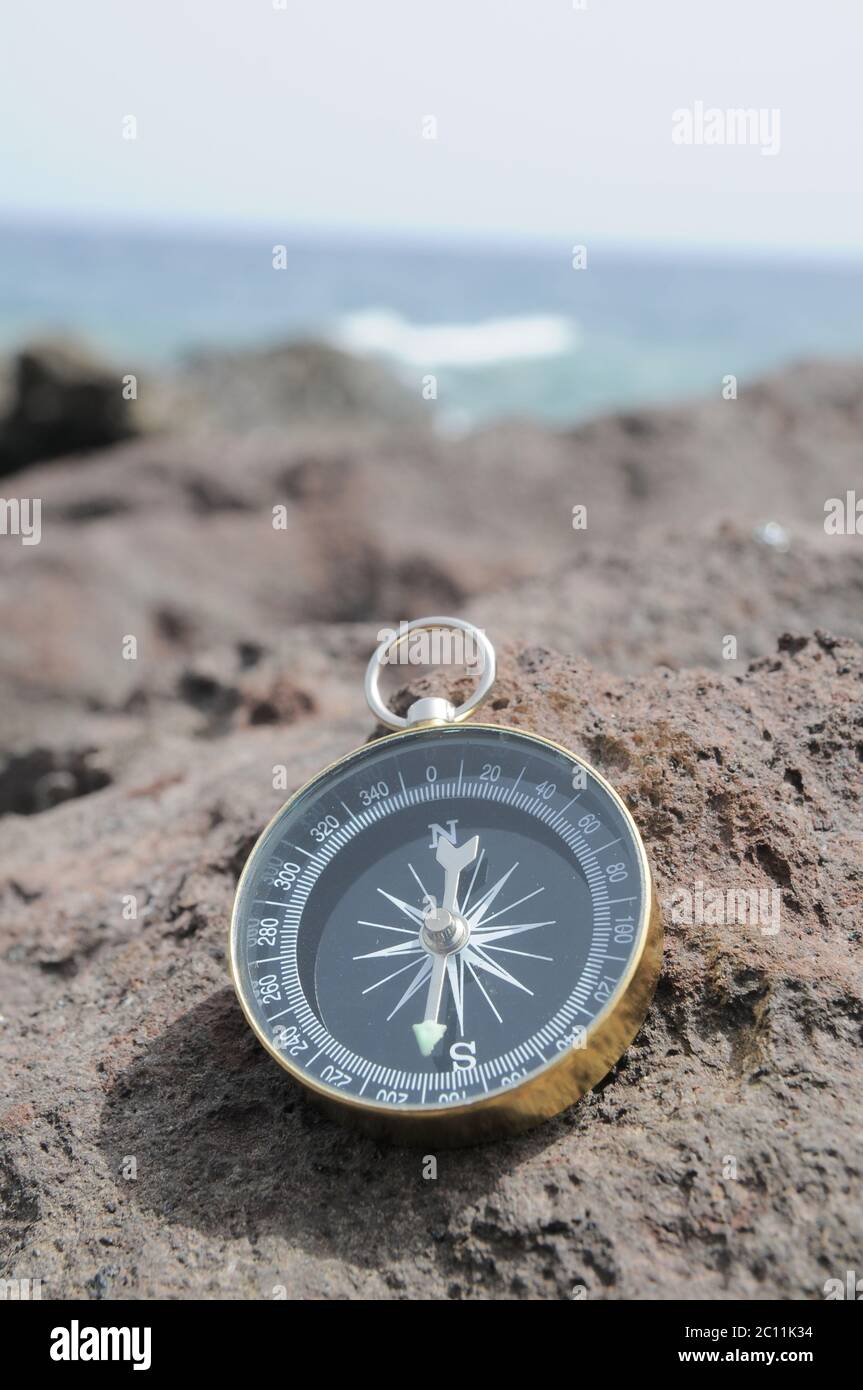 One Compass on the Rocks near the Atlantic Ocean Stock Photo - Alamy