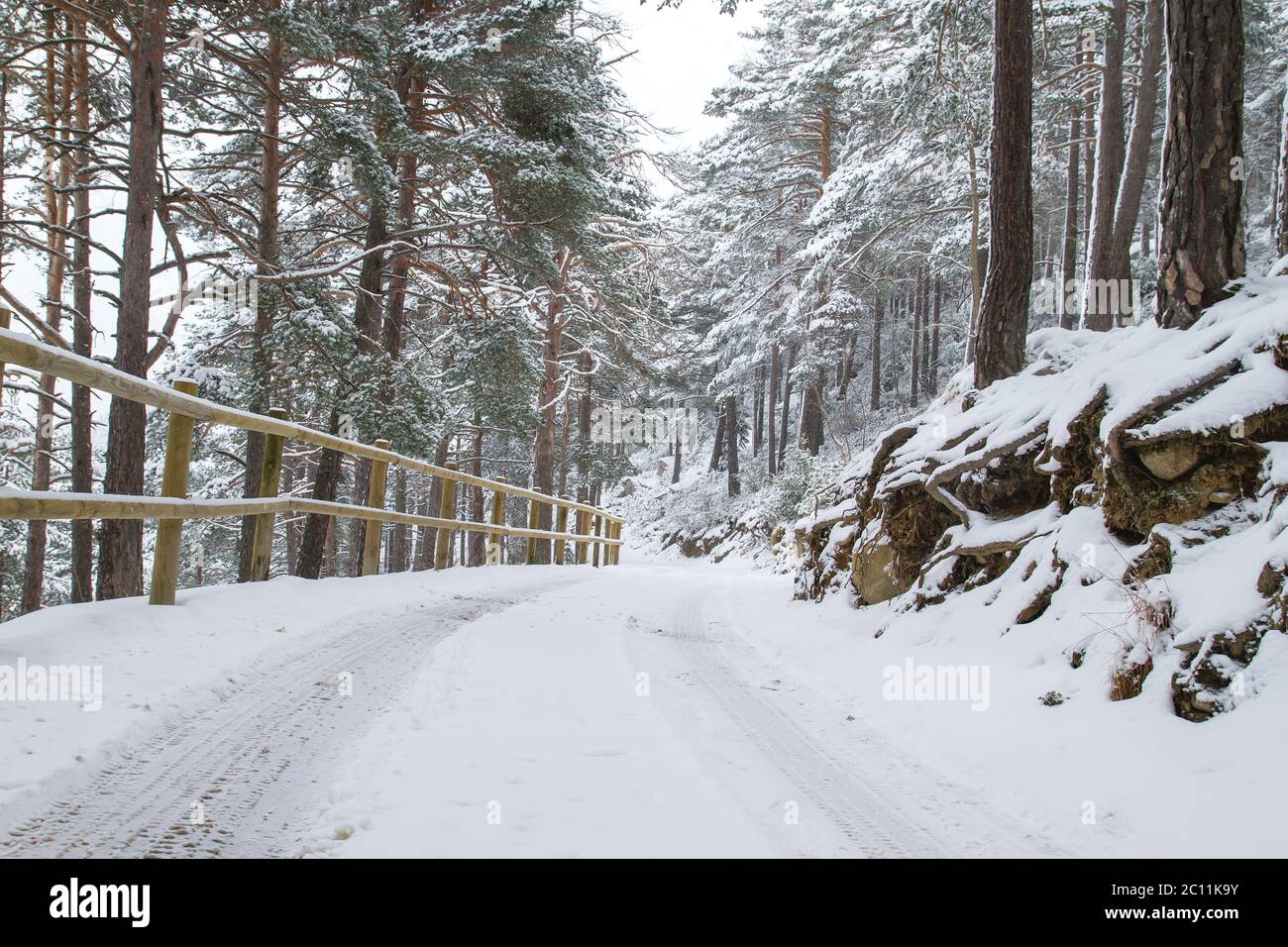 Mountain road in winter with snow Stock Photo - Alamy