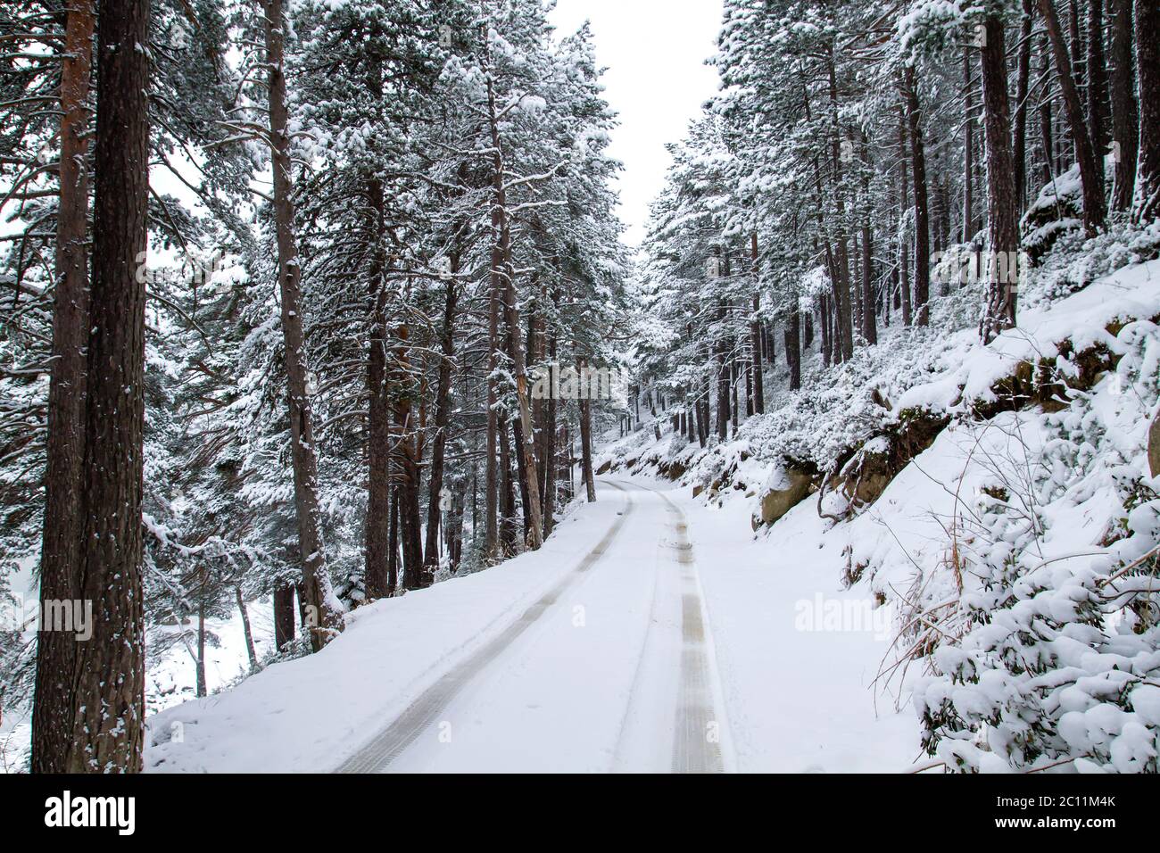 Mountain road in winter with snow Stock Photo - Alamy