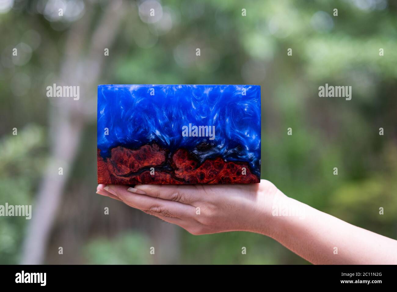 Hand holding cube casting epoxy resin with nature burl BURMA PADAUK ...