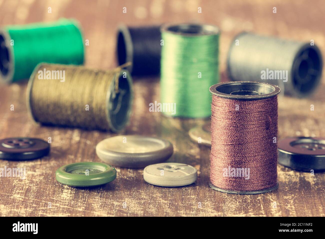 Spools of thread and buttons Stock Photo - Alamy