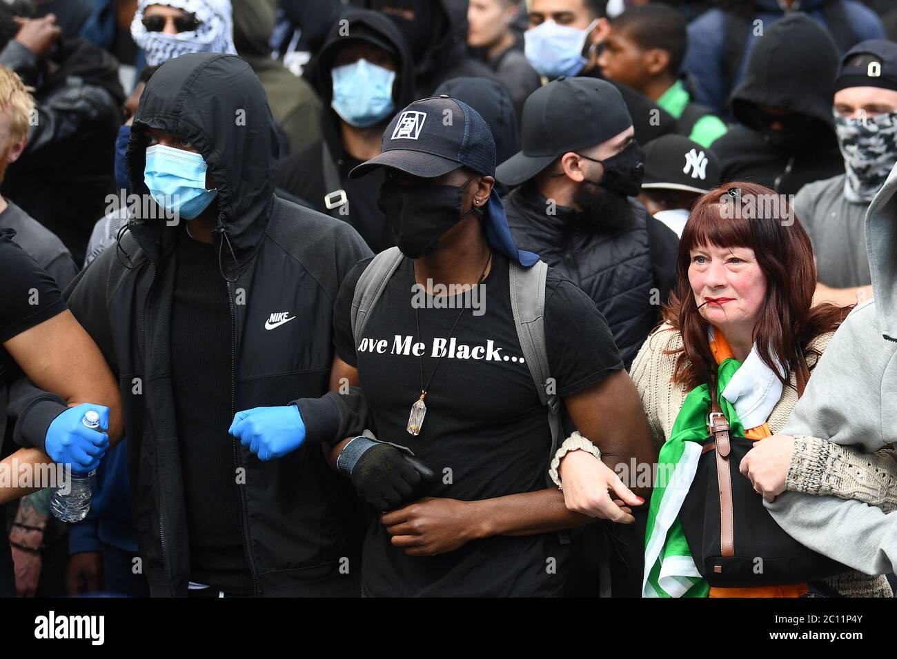People linking arms during a Black Lives Matter protest rally in ...