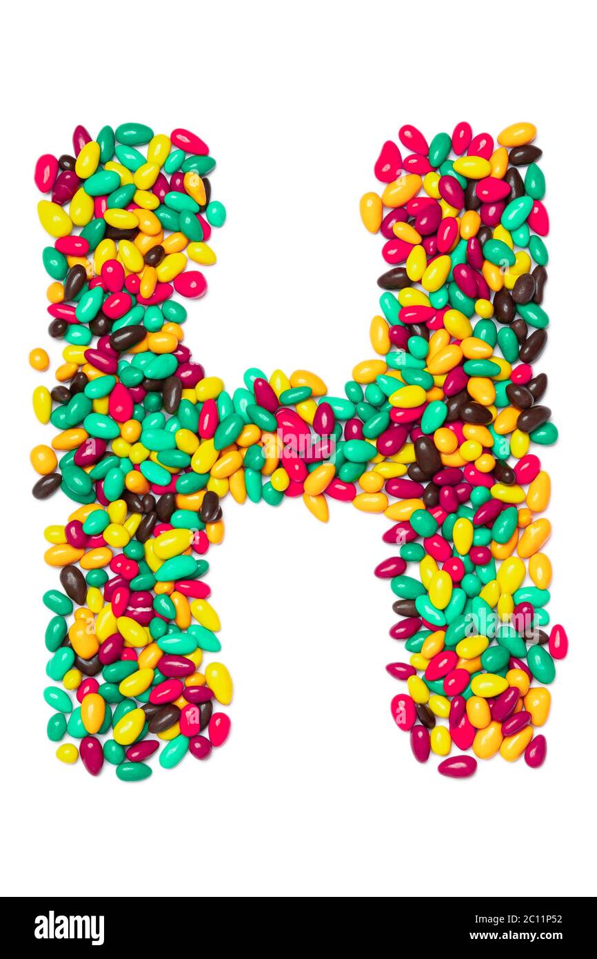 Letter H of the English alphabet from multicolored round chocolates on ...