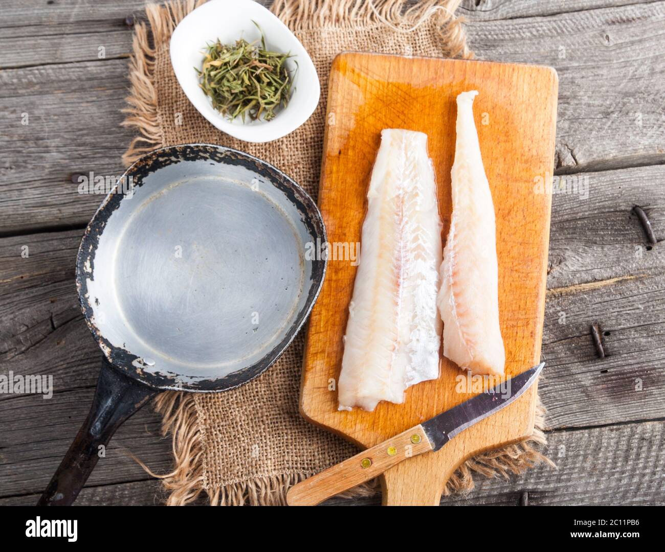 raw fish fillets for frying on pan. kitchen composition Stock Photo - Alamy