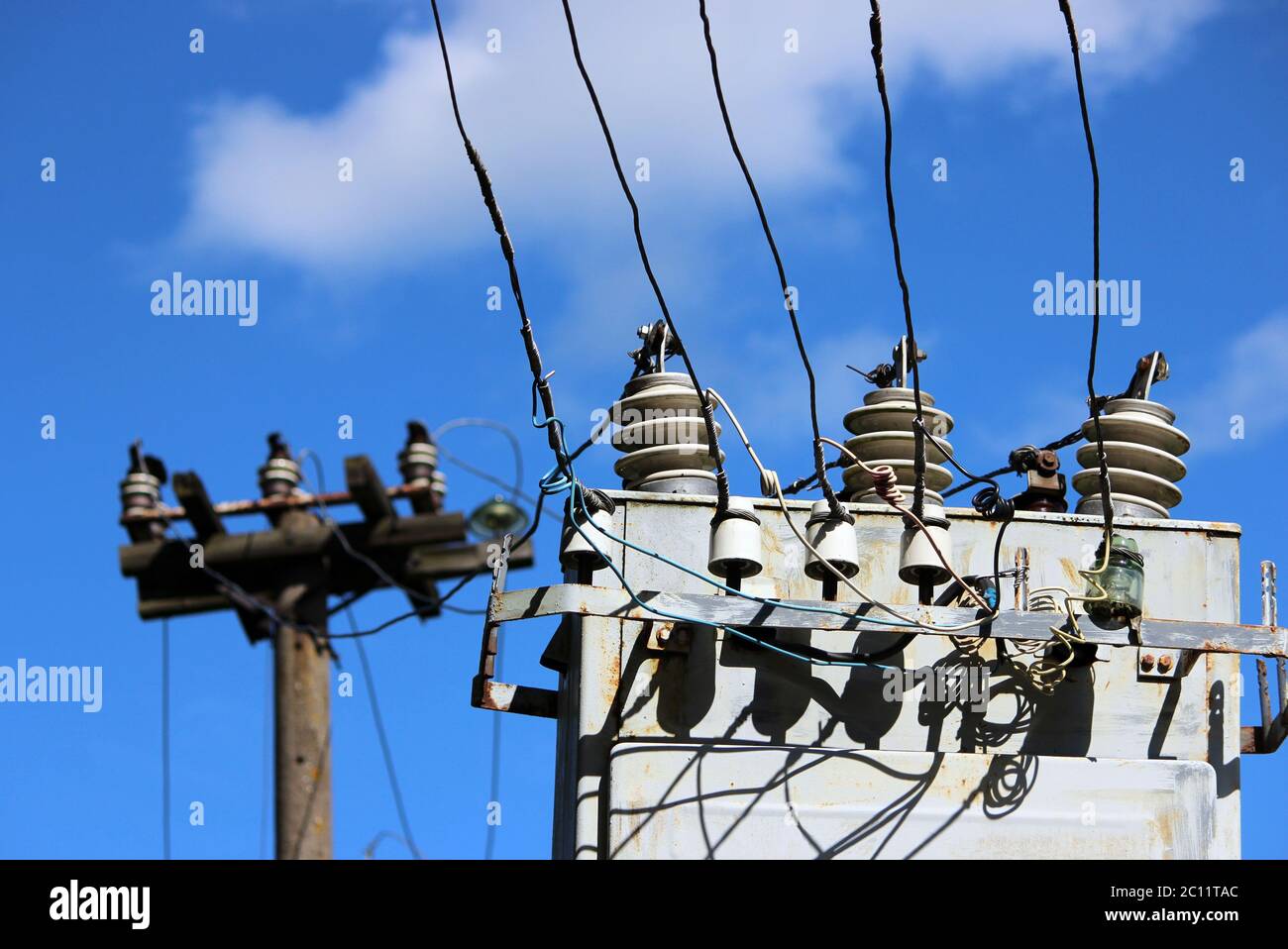 electrical wires extending from the transformer station near the ...