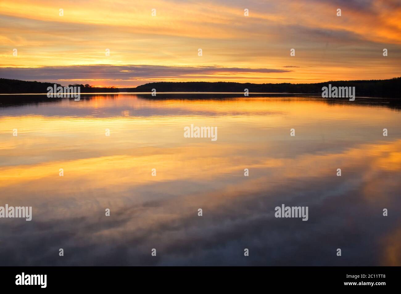 Beautiful calm lake with reflections in water photographed in sunset ...