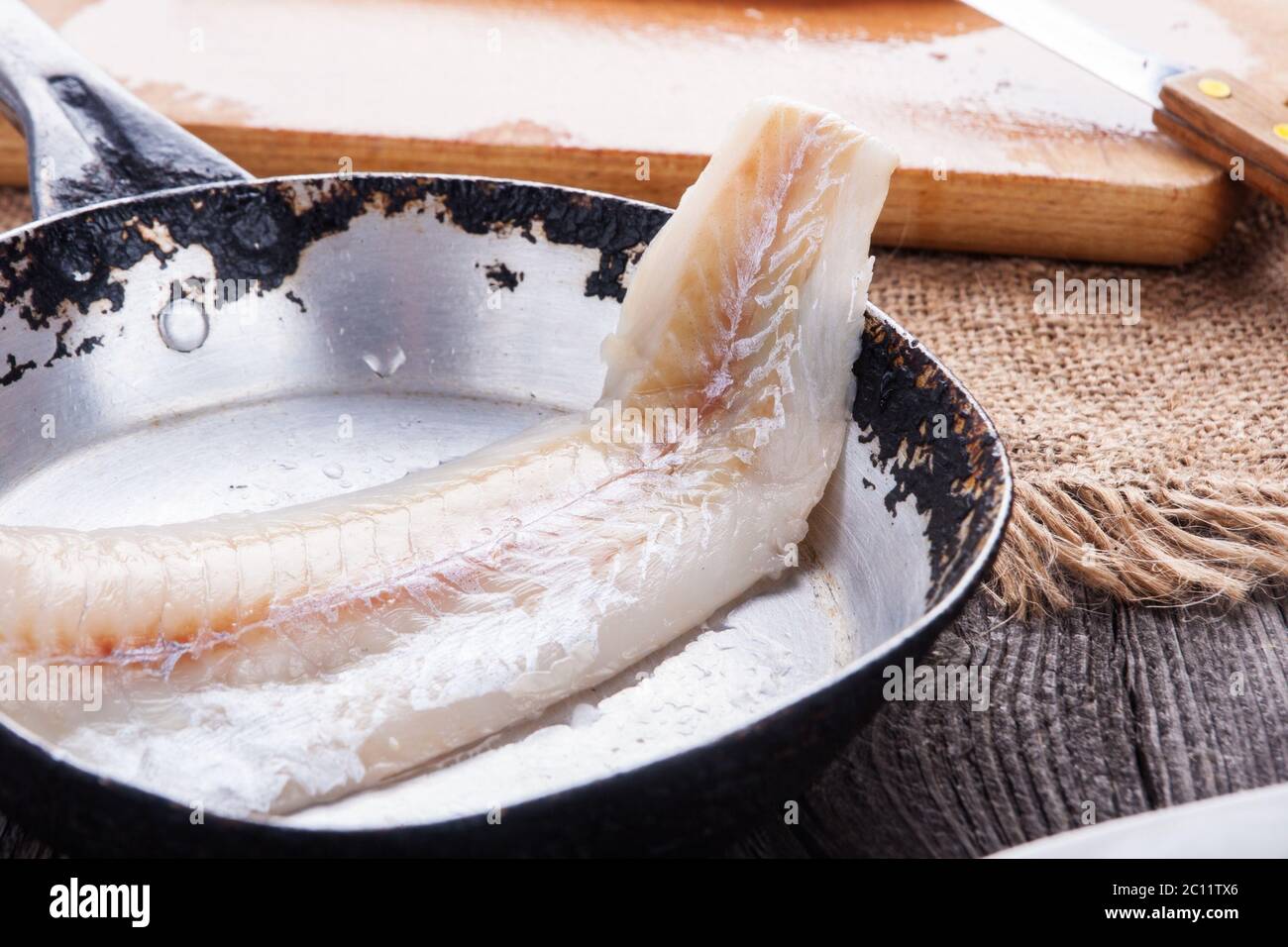 raw fish fillets for frying on pan. kitchen composition Stock Photo - Alamy