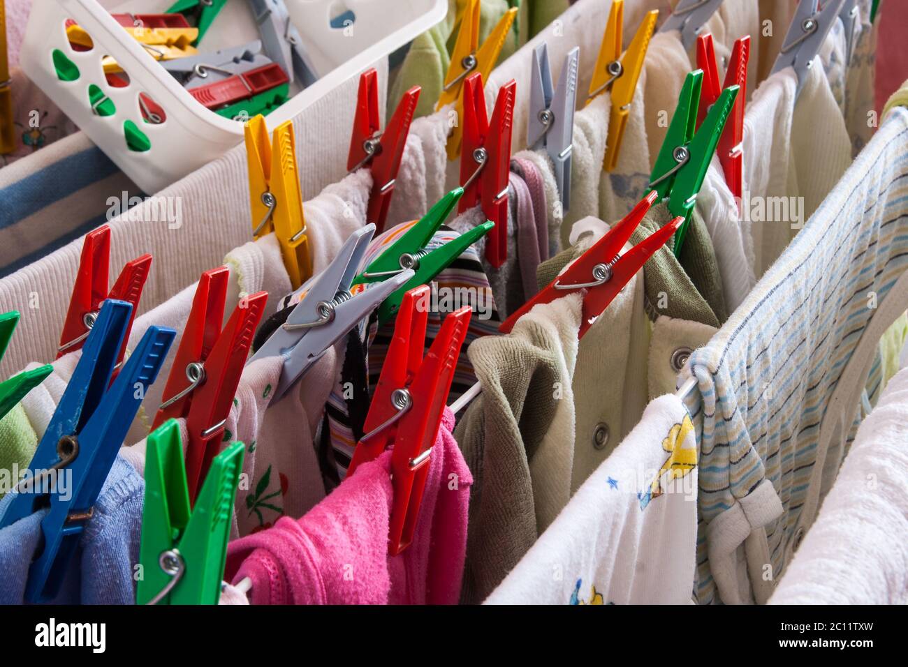 Laundry clips and clothing on a clothes line Stock Photo - Alamy