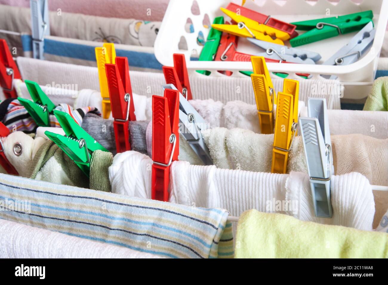 Laundry clips and clothing on a clothes line Stock Photo - Alamy