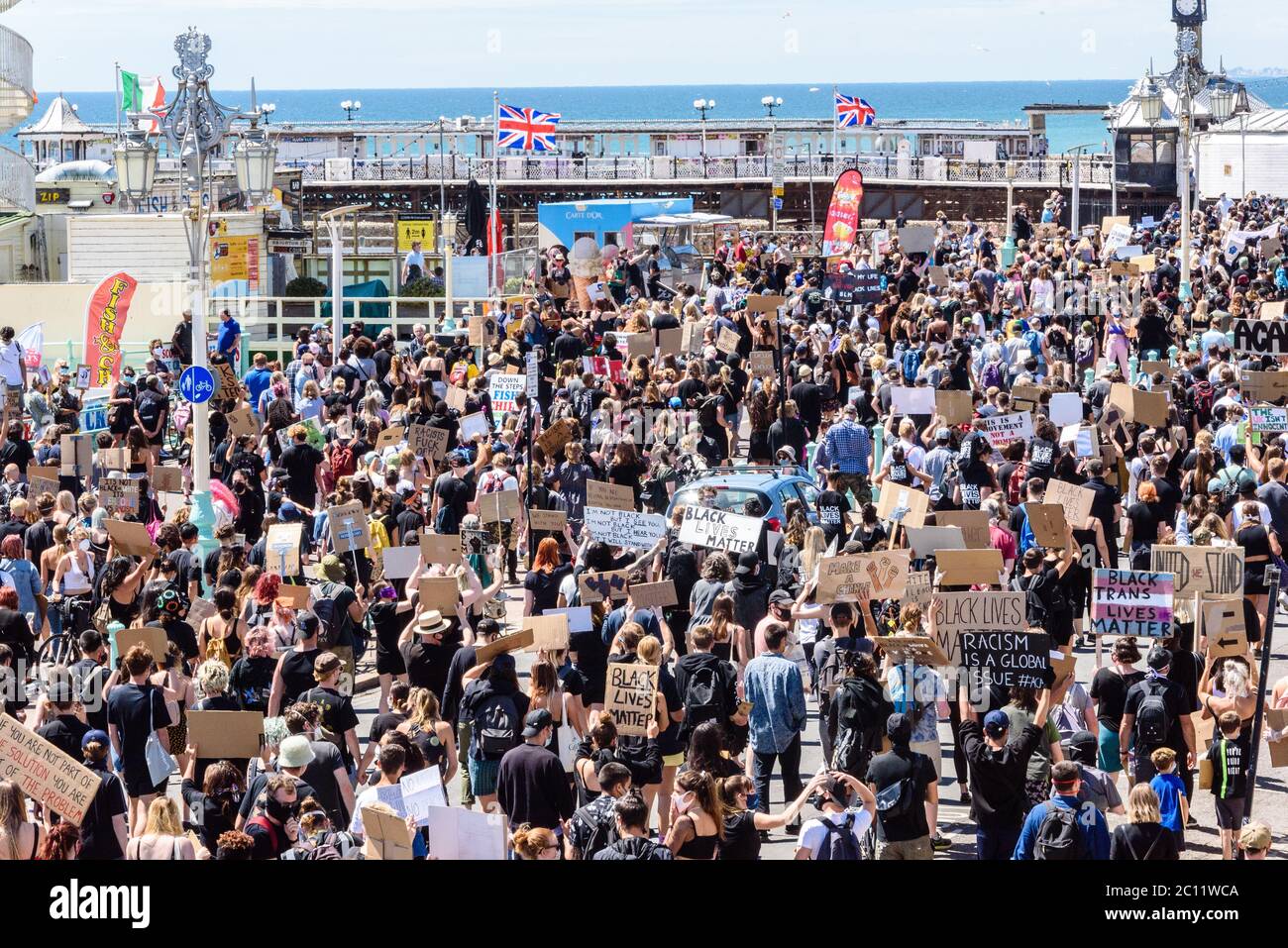Brighton, East Sussex, UK. 13th June 2020.Crowds throng Madeira Drive ...