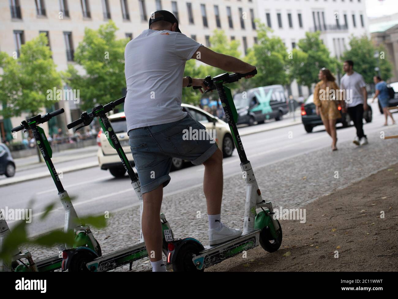 Berlin, Germany. 12th June, 2020. A man starts to ride an electric ...