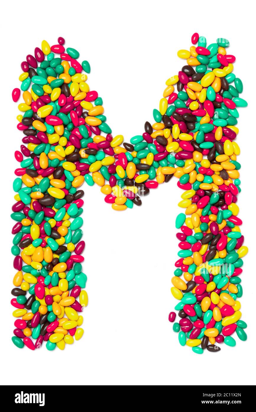 Letter M of the English alphabet from multicolored round chocolates on ...