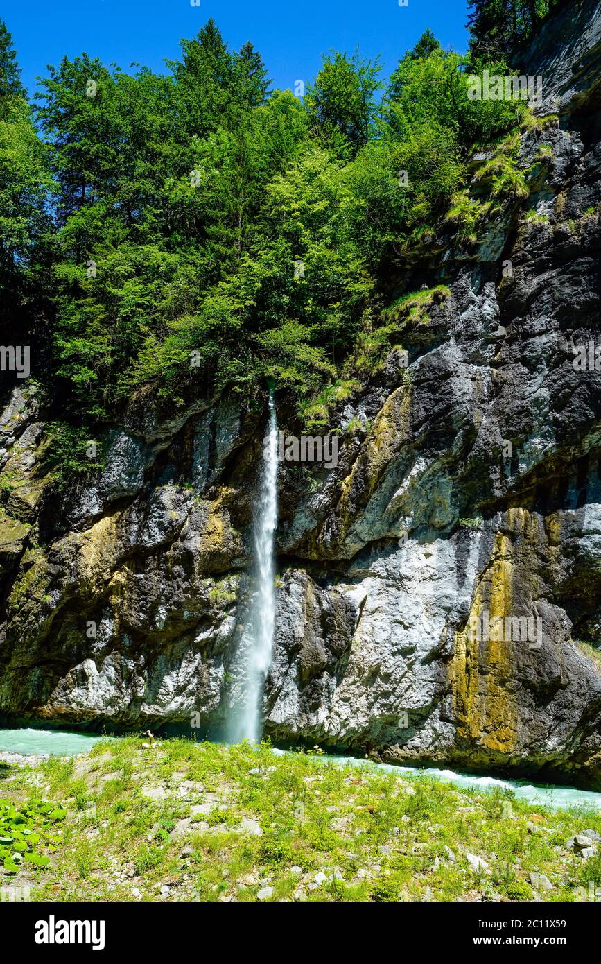 Waterfall in Aare river gorge (Aareschlucht). The gorge length is over ...