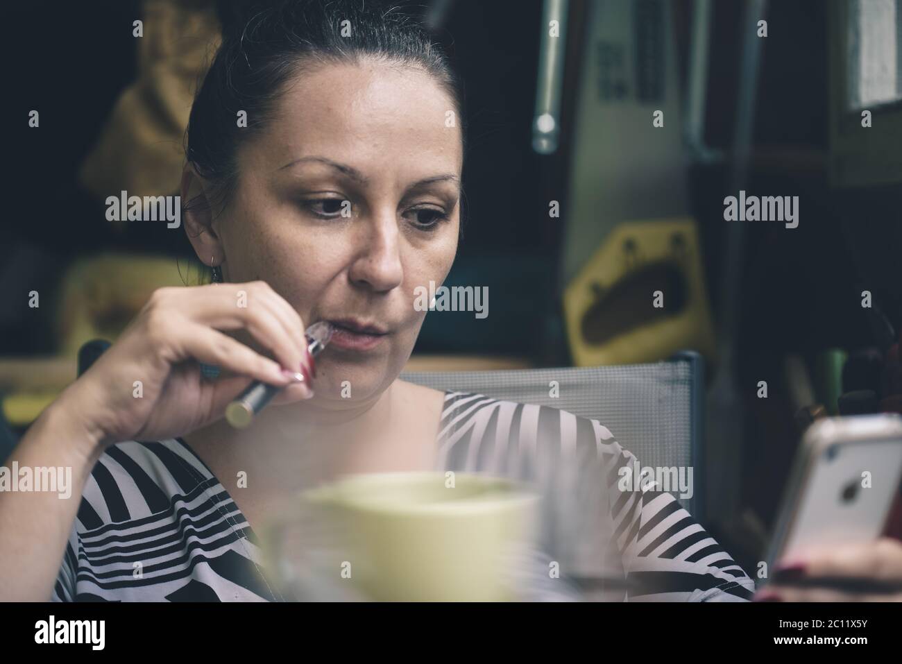 Woman sitting close up Stock Photo - Alamy