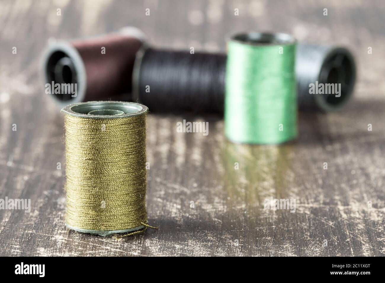 Bobbins with threads Stock Photo - Alamy