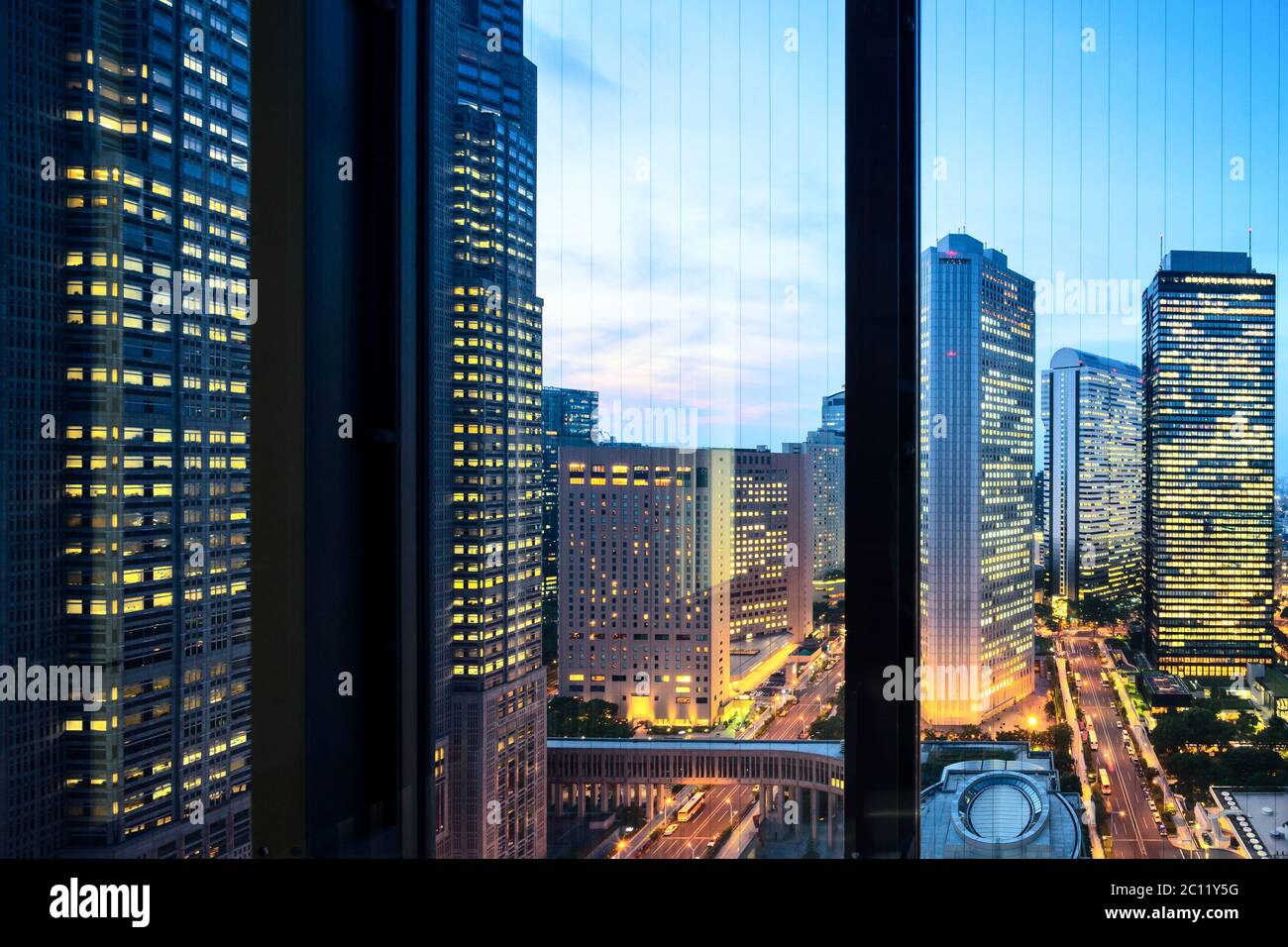 modern office buildings in tokyo through window Stock Photo - Alamy
