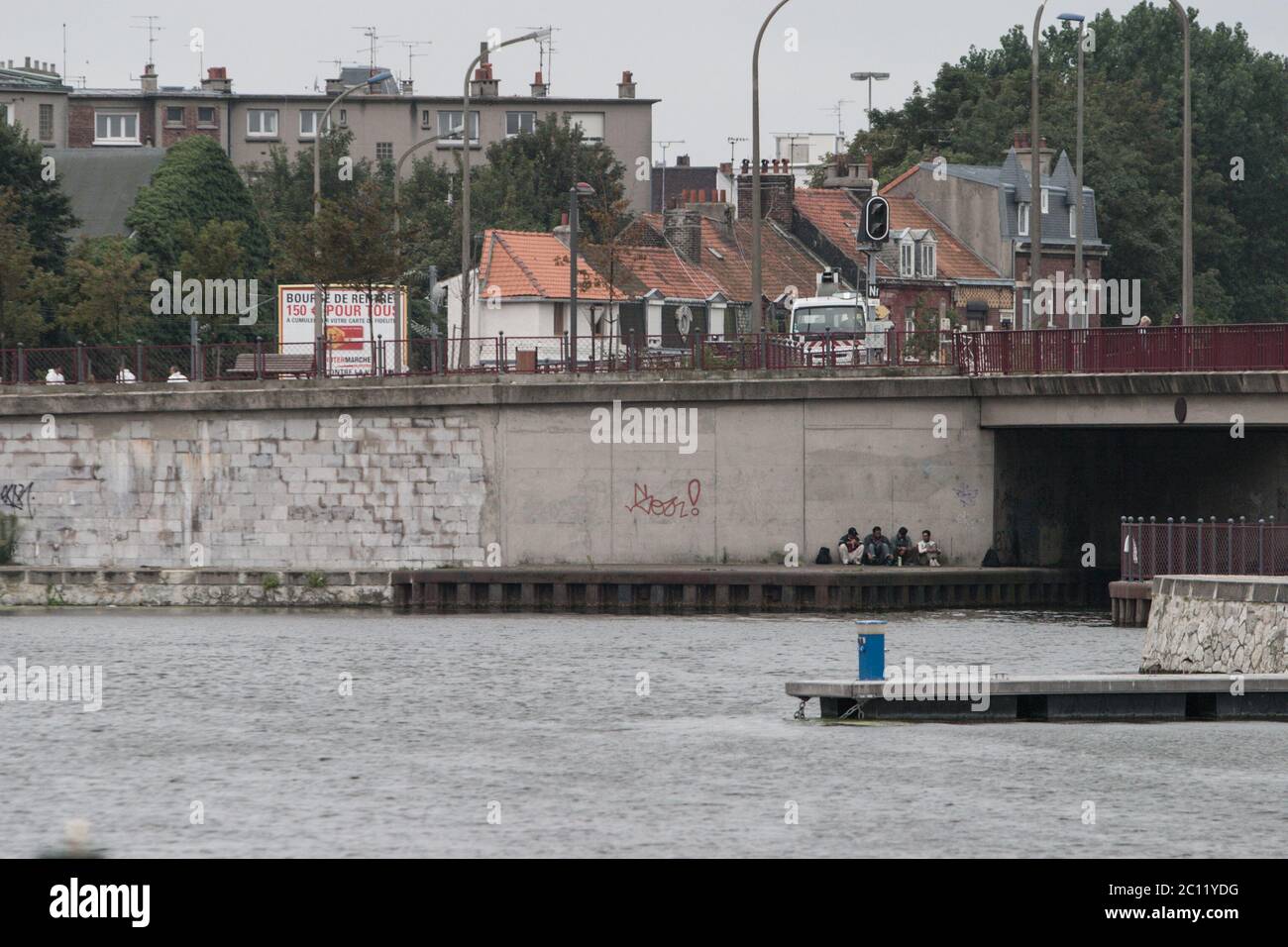 Immigrants on the back streets of Calais Stock Photo - Alamy