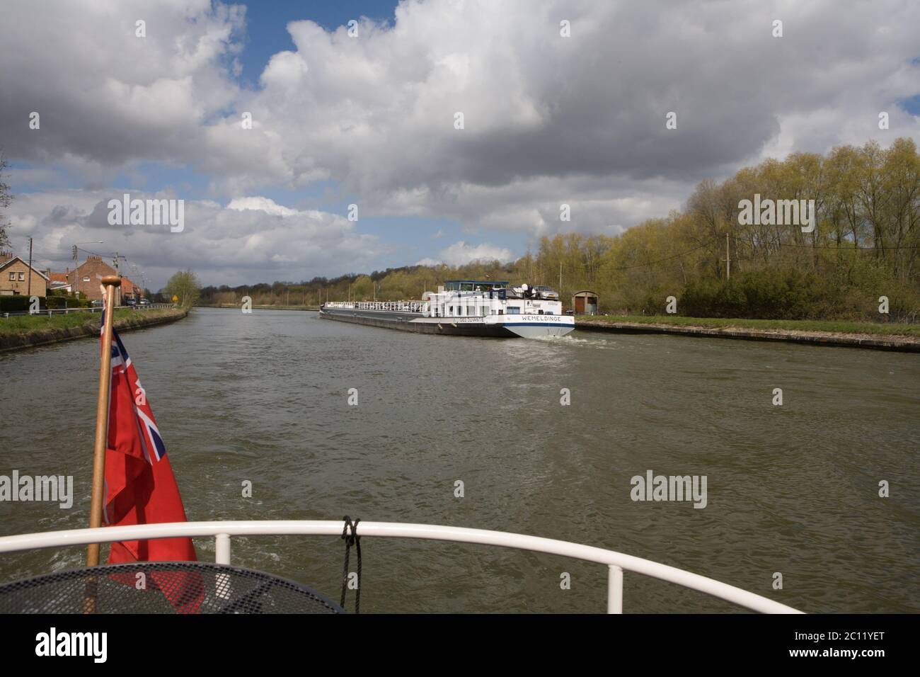 British barge passing French commercial barge Stock Photo - Alamy