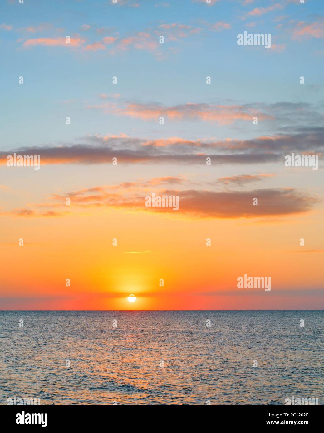 Sunset in the sea Stock Photo - Alamy