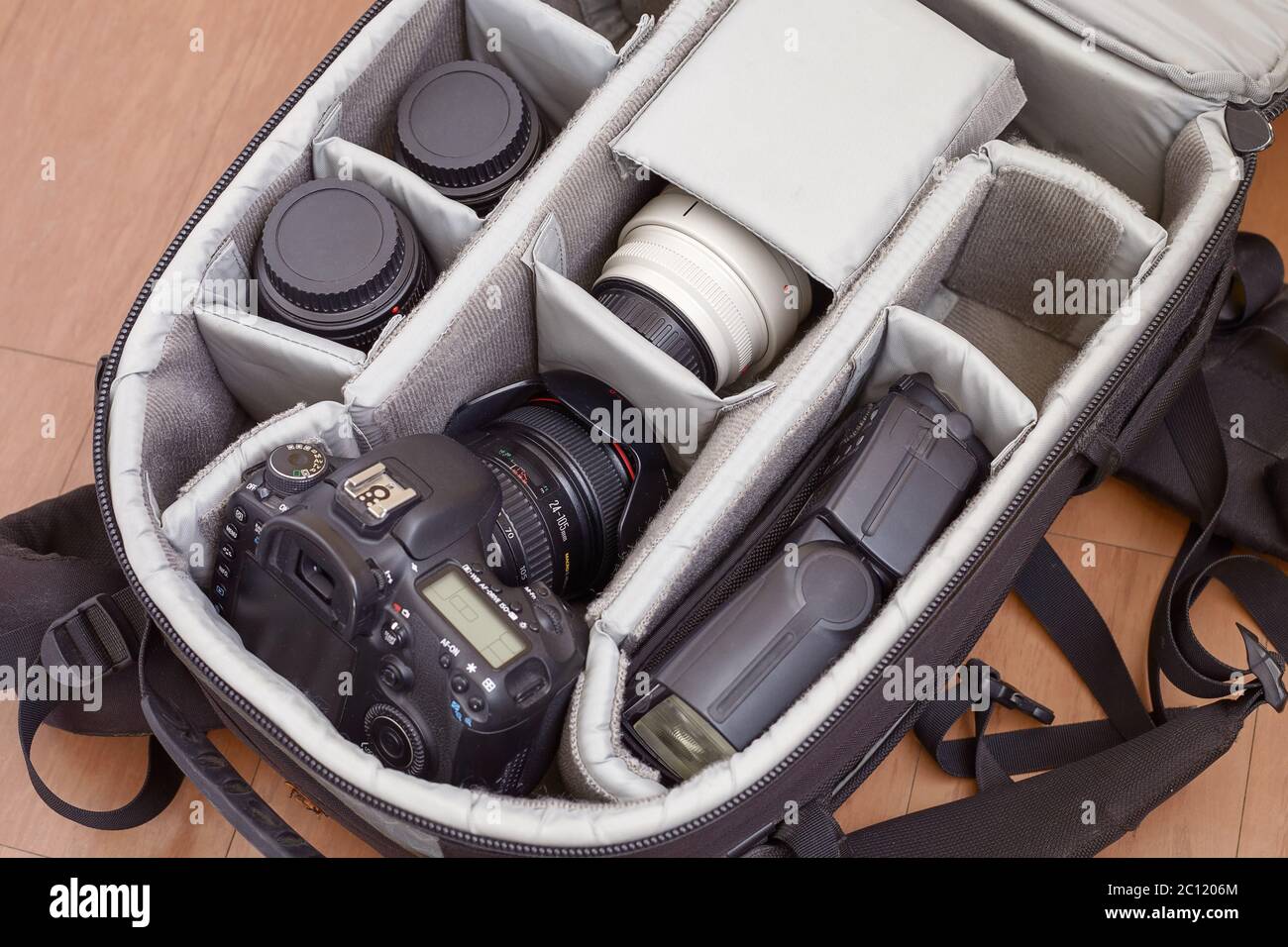 The Camera with Lenses and Flash in a Backpack Stock Photo - Alamy