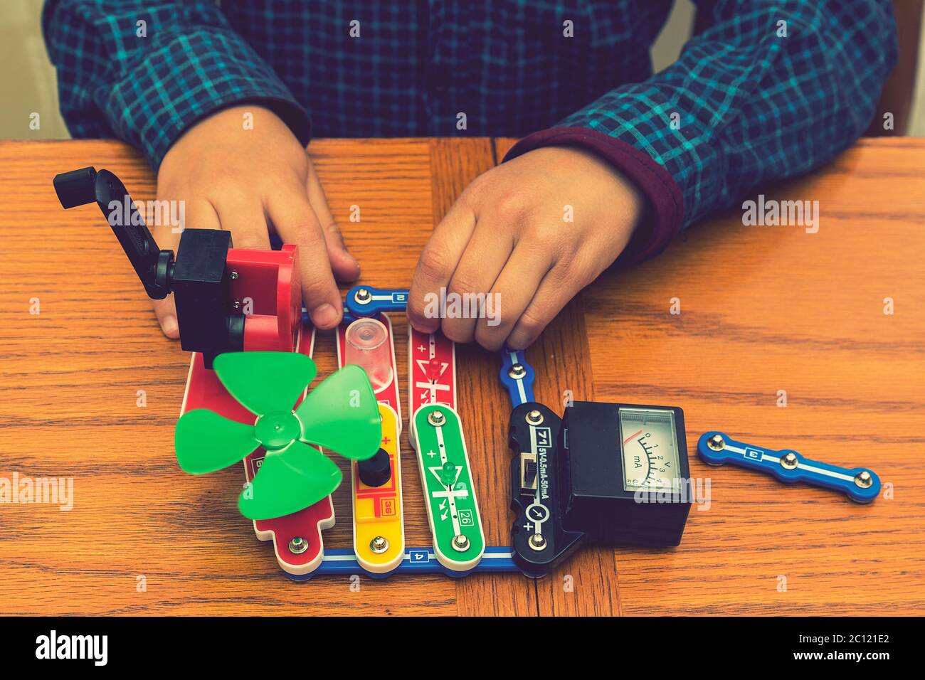 The boy playing an electric constructor. The child is played by ...