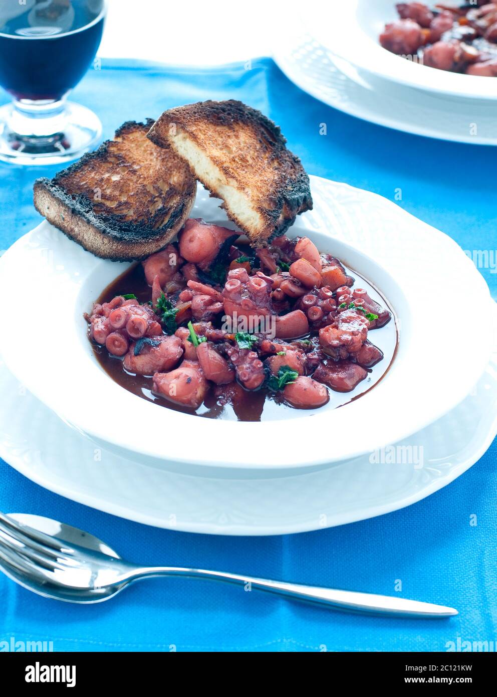 delicious octopus stew typical Italian recipe Stock Photo - Alamy