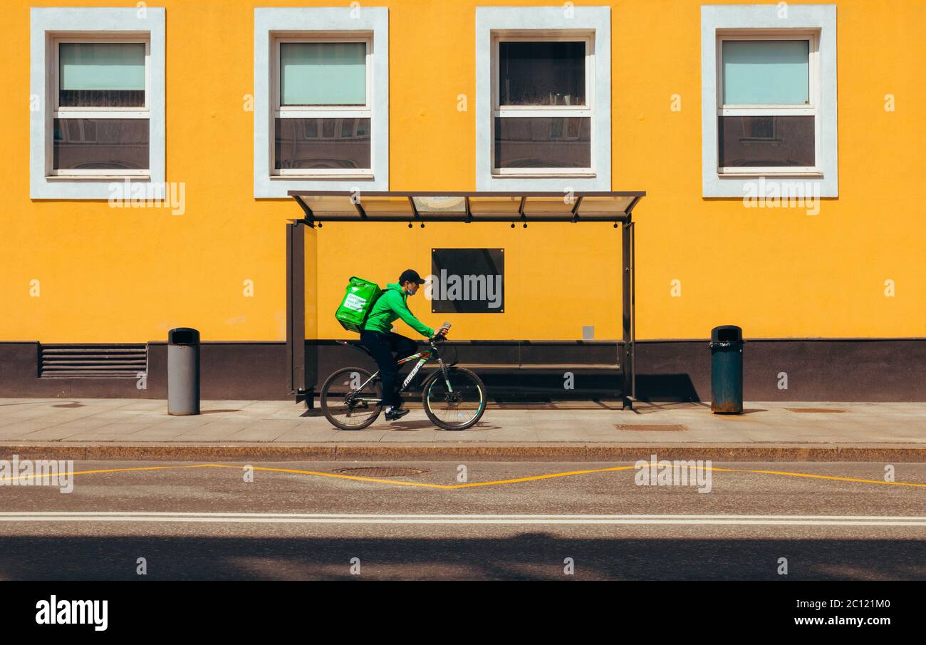 Takeaway food delivery boy on bike with isothermal food case box ...