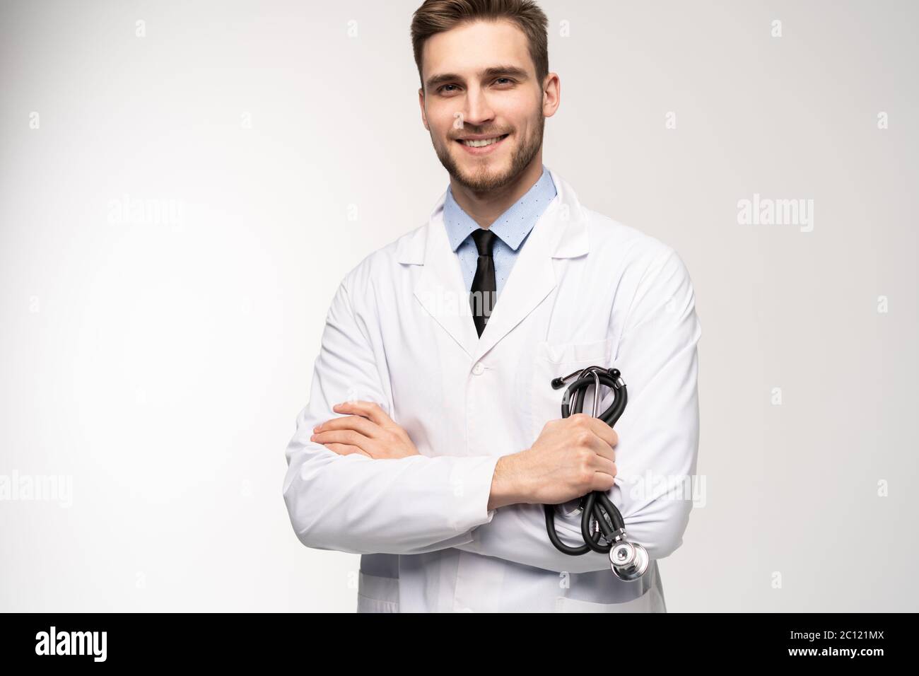 Smiling medical worker in white coat isolated on white Stock Photo - Alamy