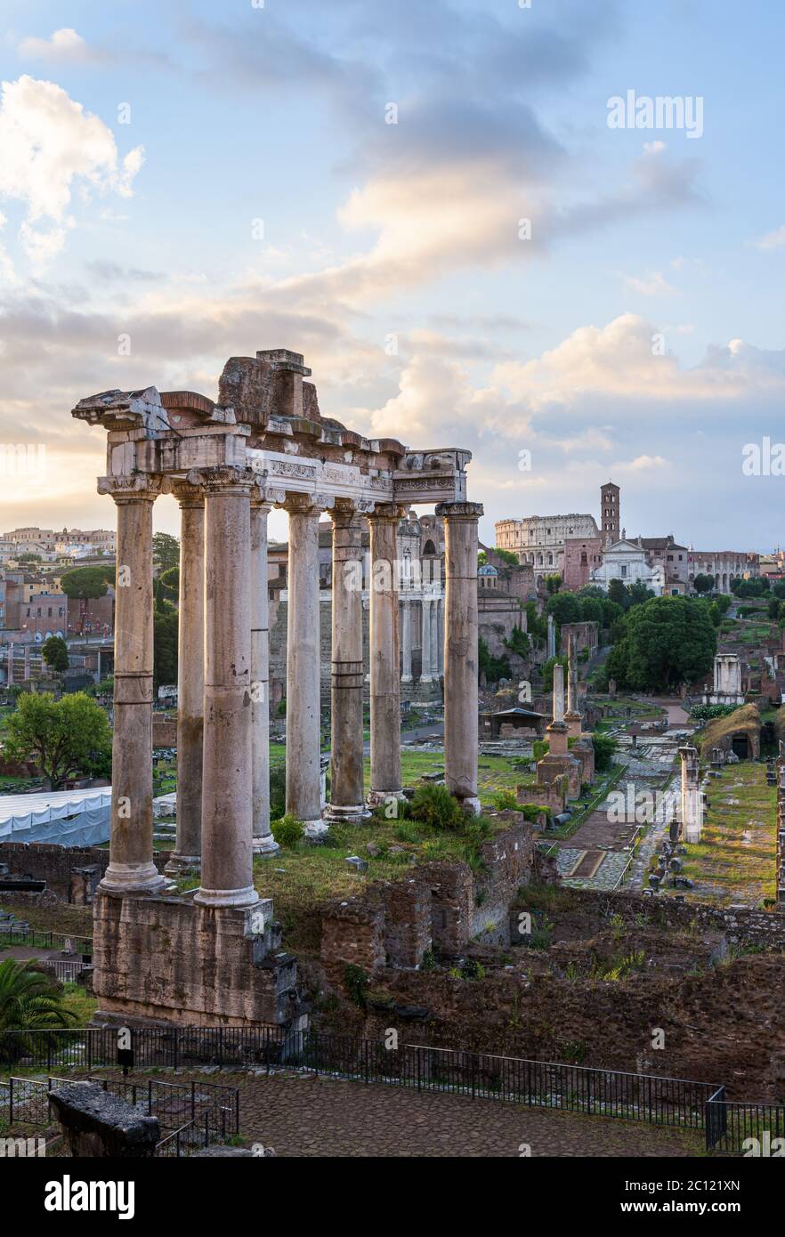 Columns of the ancient Temple of Saturn at sunrise, in the Roman Forum ...