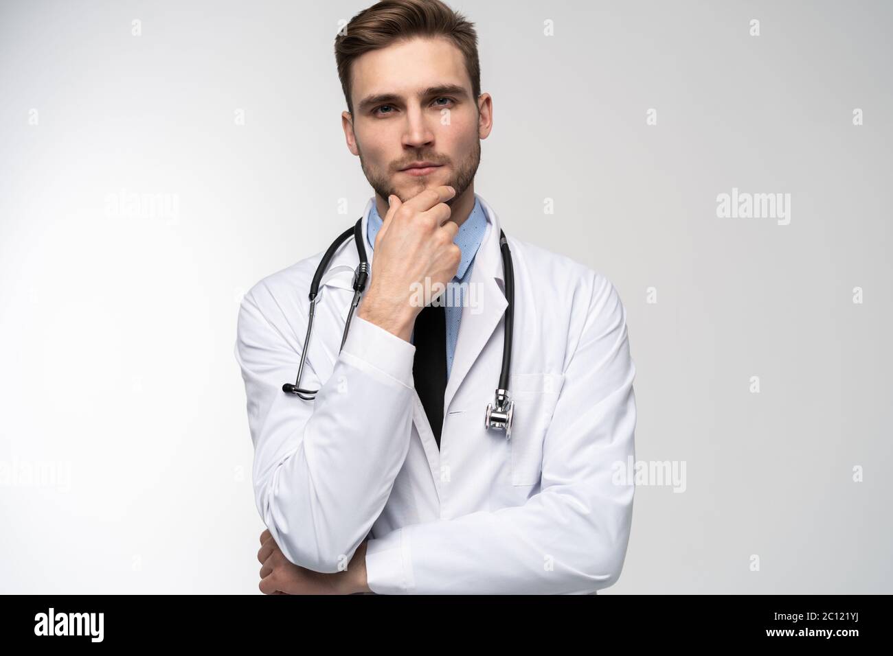 Smiling medical worker in white coat isolated on white Stock Photo - Alamy