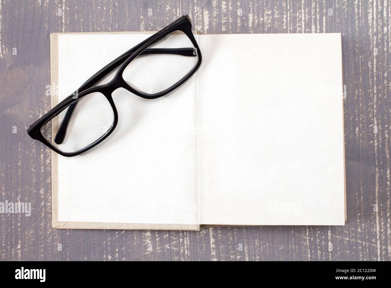 Open book with glasses hi-res stock photography and images - Alamy