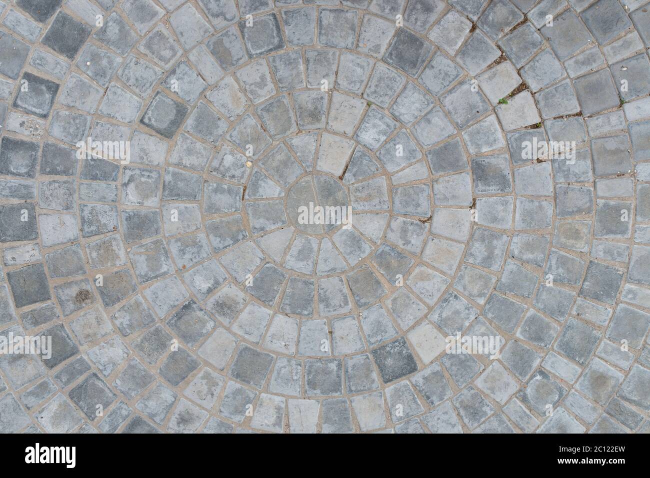 Cobble circular pattern block pavement texture background. Top view ...