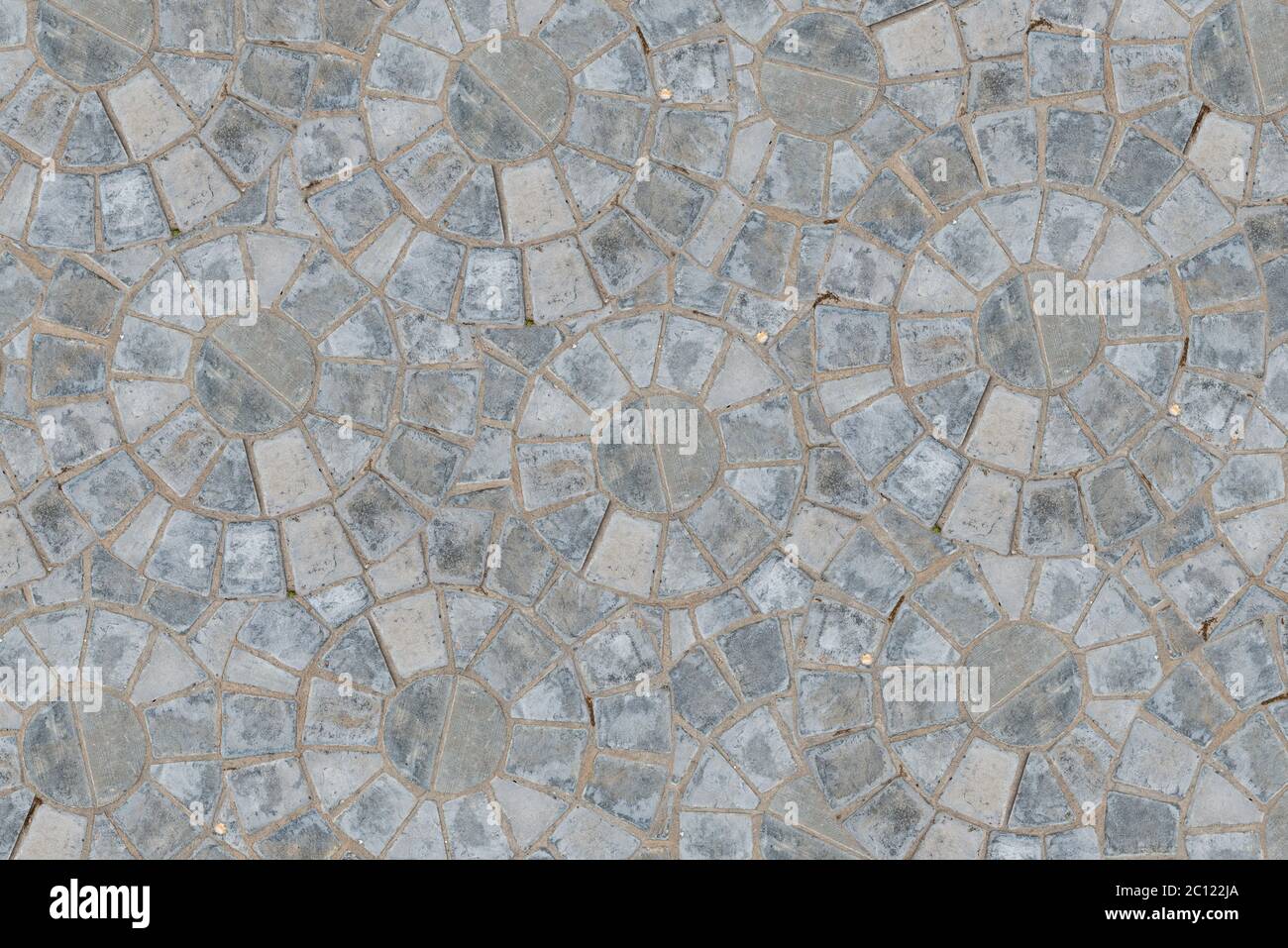 Cobble circular pattern block pavement texture background. Top view ...