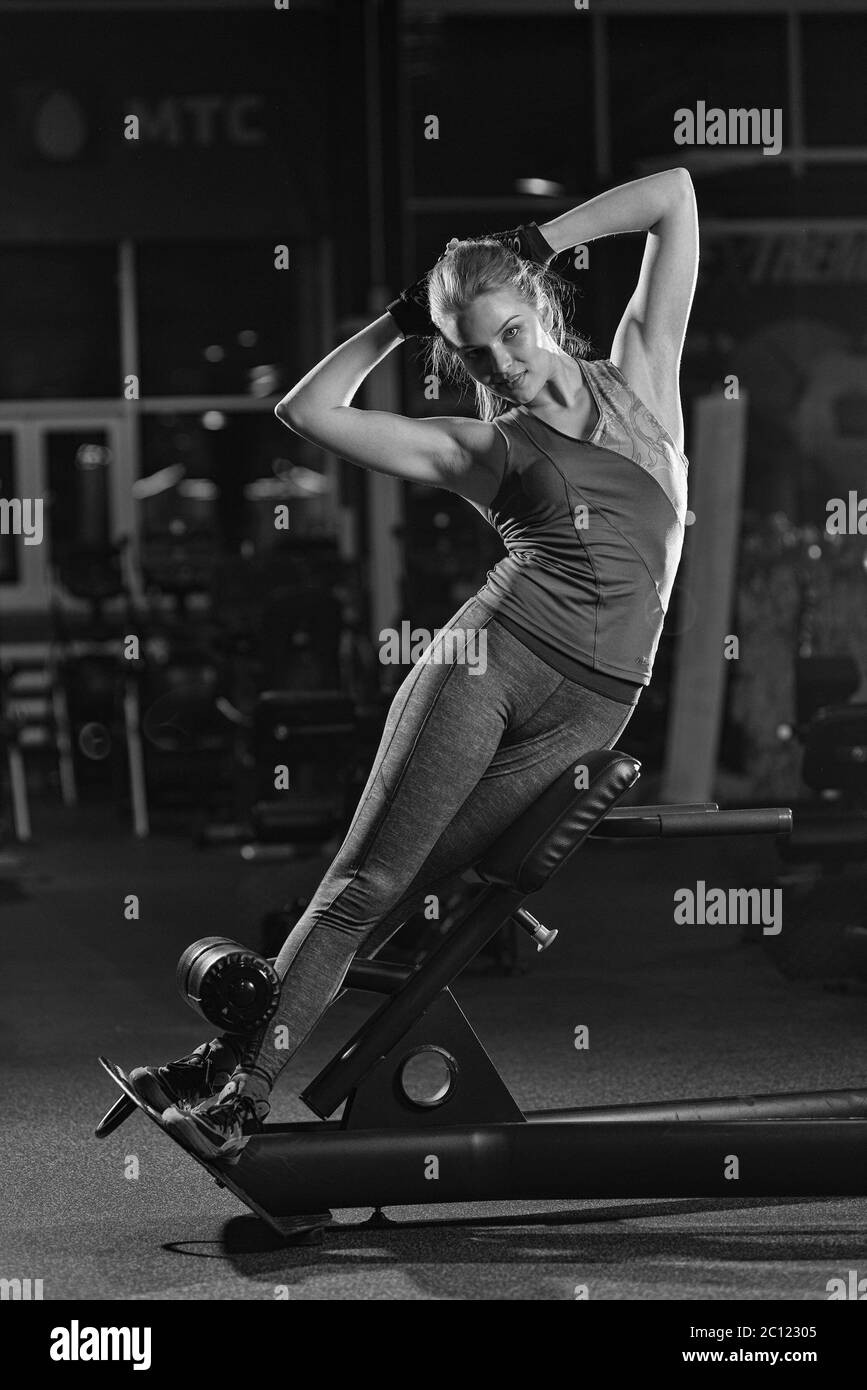 Woman doing strength exercises for abs muscles Stock Photo - Alamy