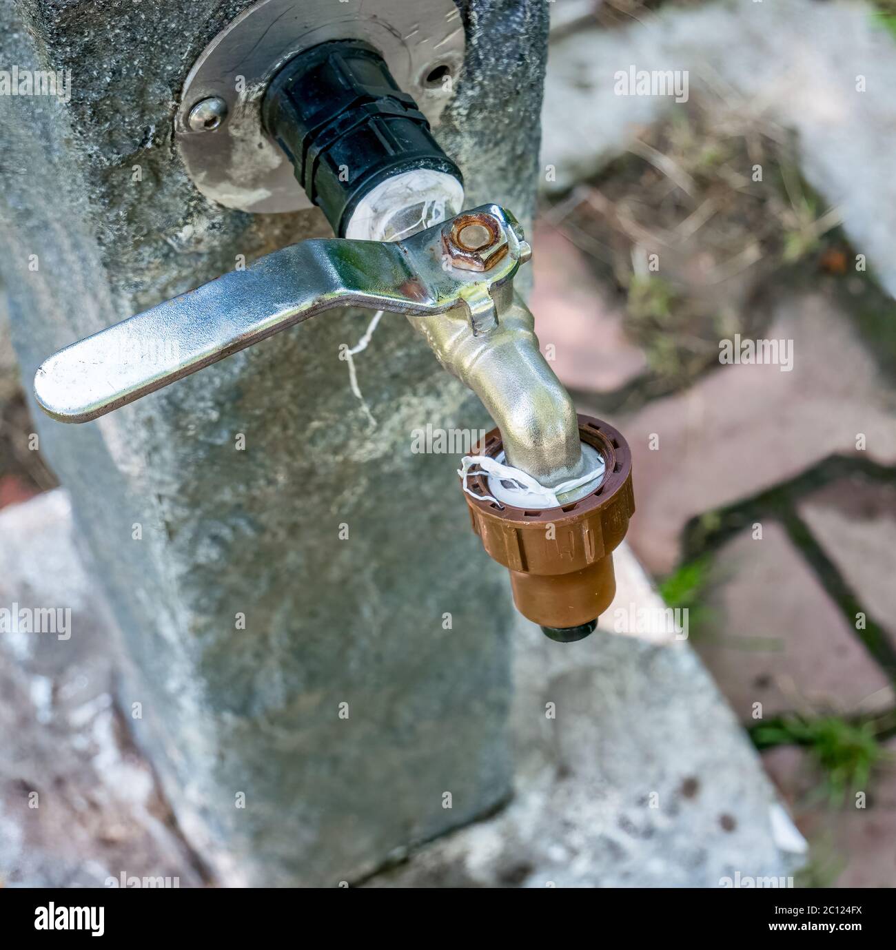 Outdoor water tap. Close up with a faucet in a park Stock Photo - Alamy